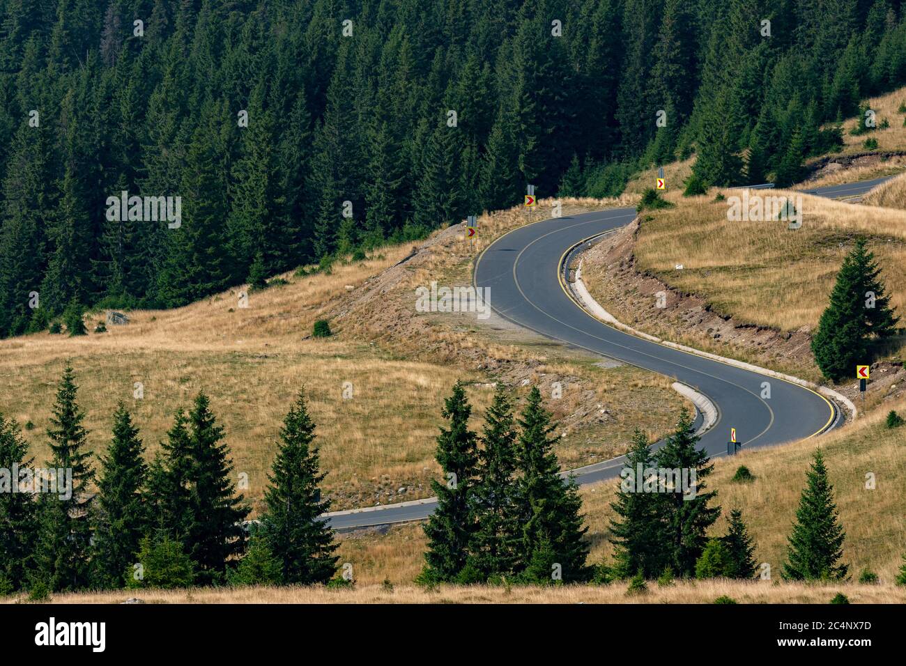 Road passes through hills hi-res stock photography and images - Alamy