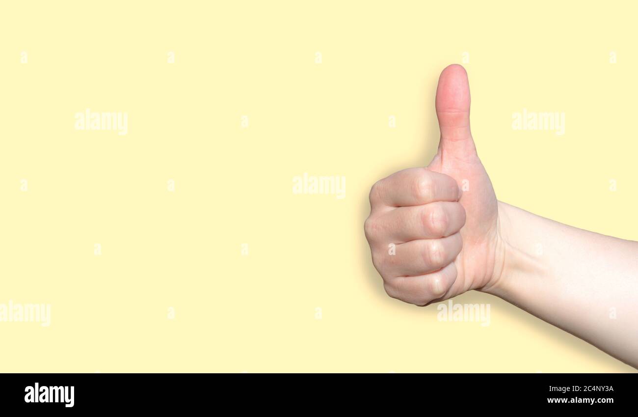 Hand making an approval gesture doing the like symbol with fingers on a ...