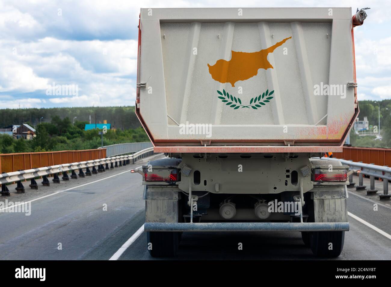 Big dirty truck with the national flag of Cyprus moving on the highway ...