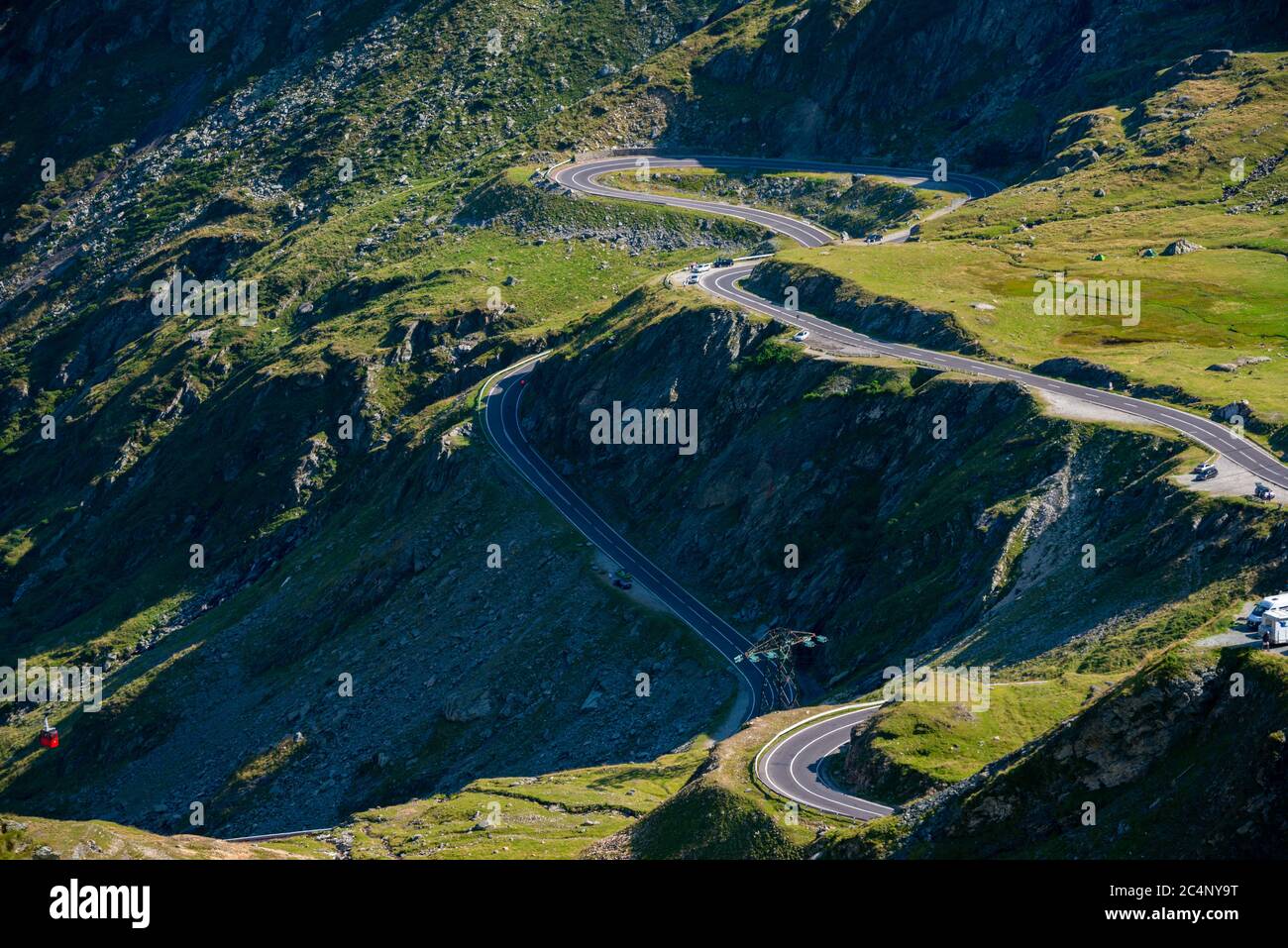 the mountain road passes through the massive rocks of the mountain ...