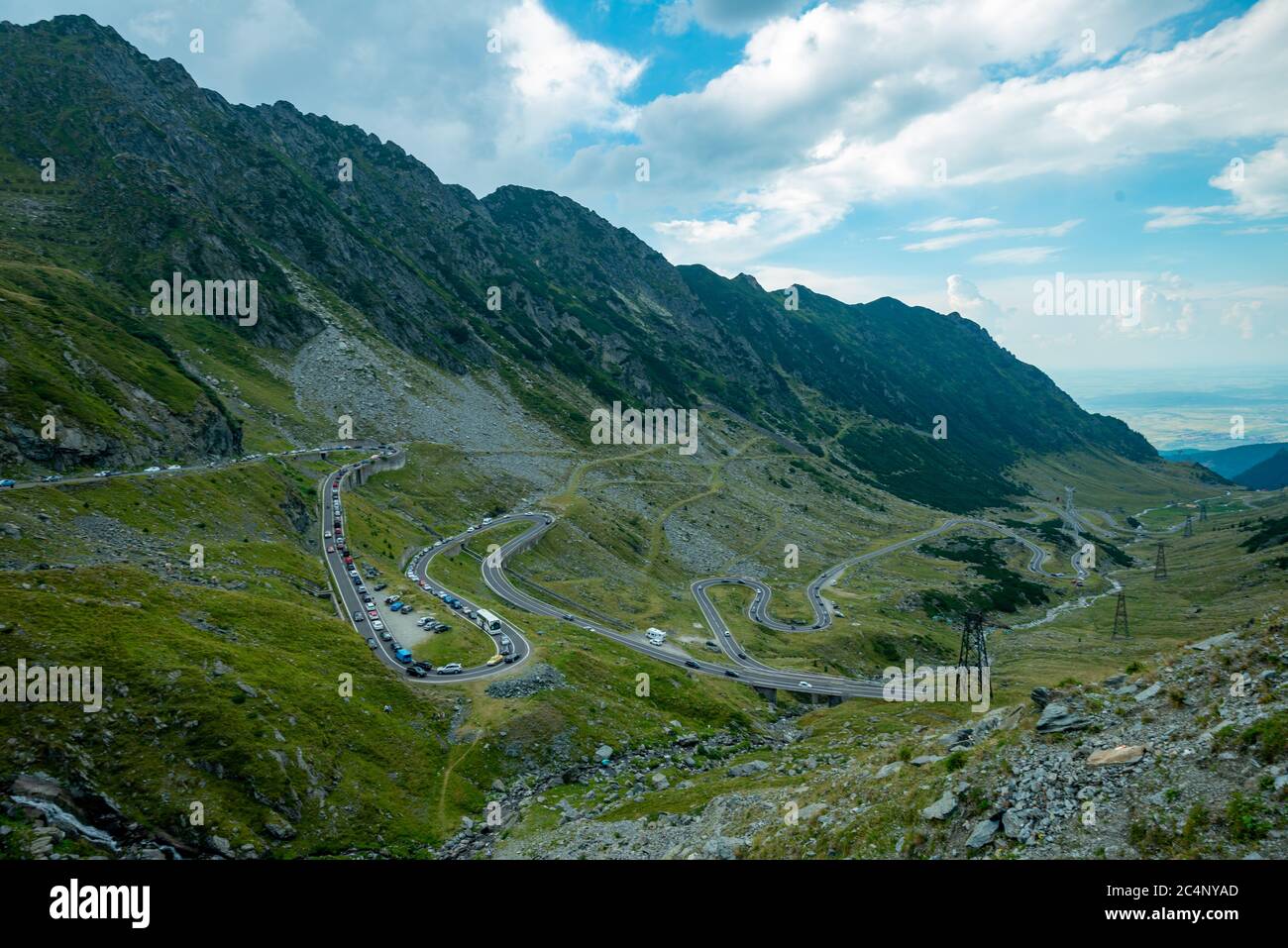 the mountain road passes through the massive rocks of the mountain ...