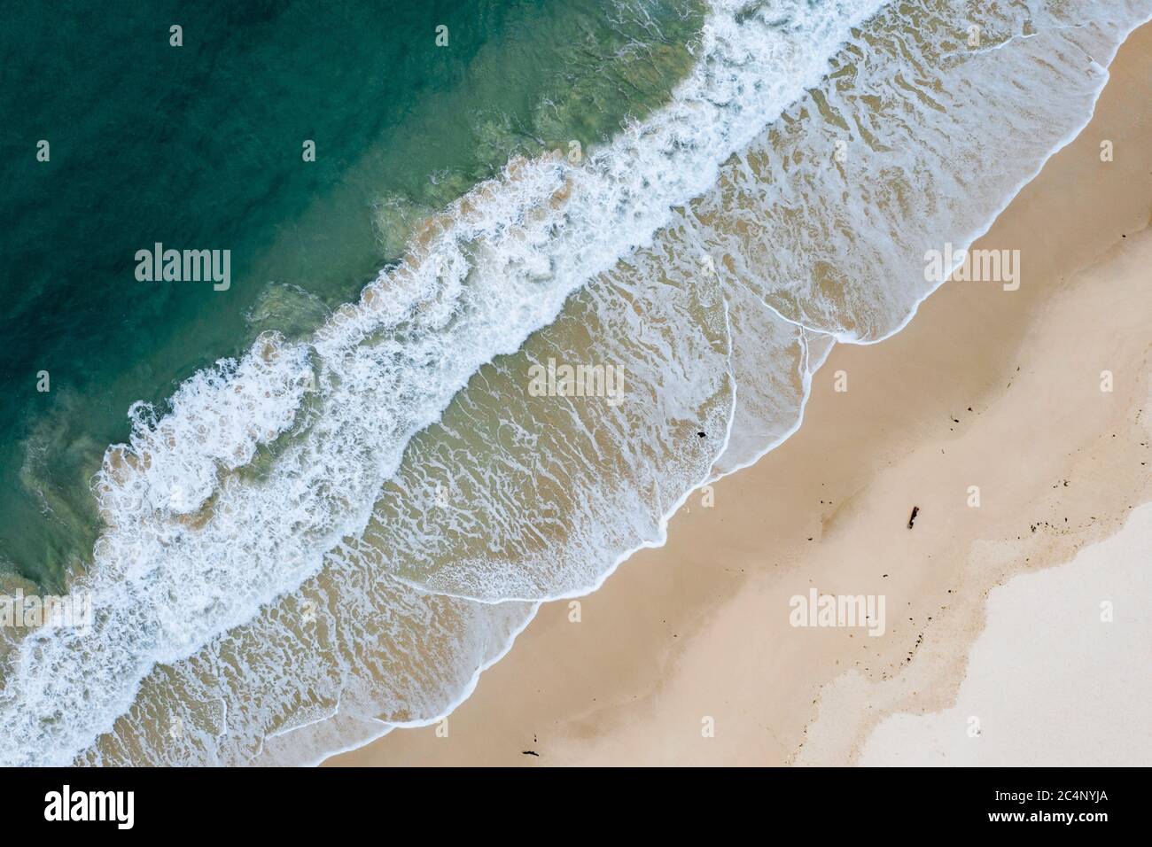 Aerial view of beautiful sea waves on the beach Stock Photo - Alamy