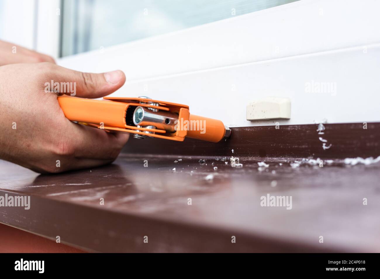 Construction work - installation of rivets. Window tint repair. Plastic ...