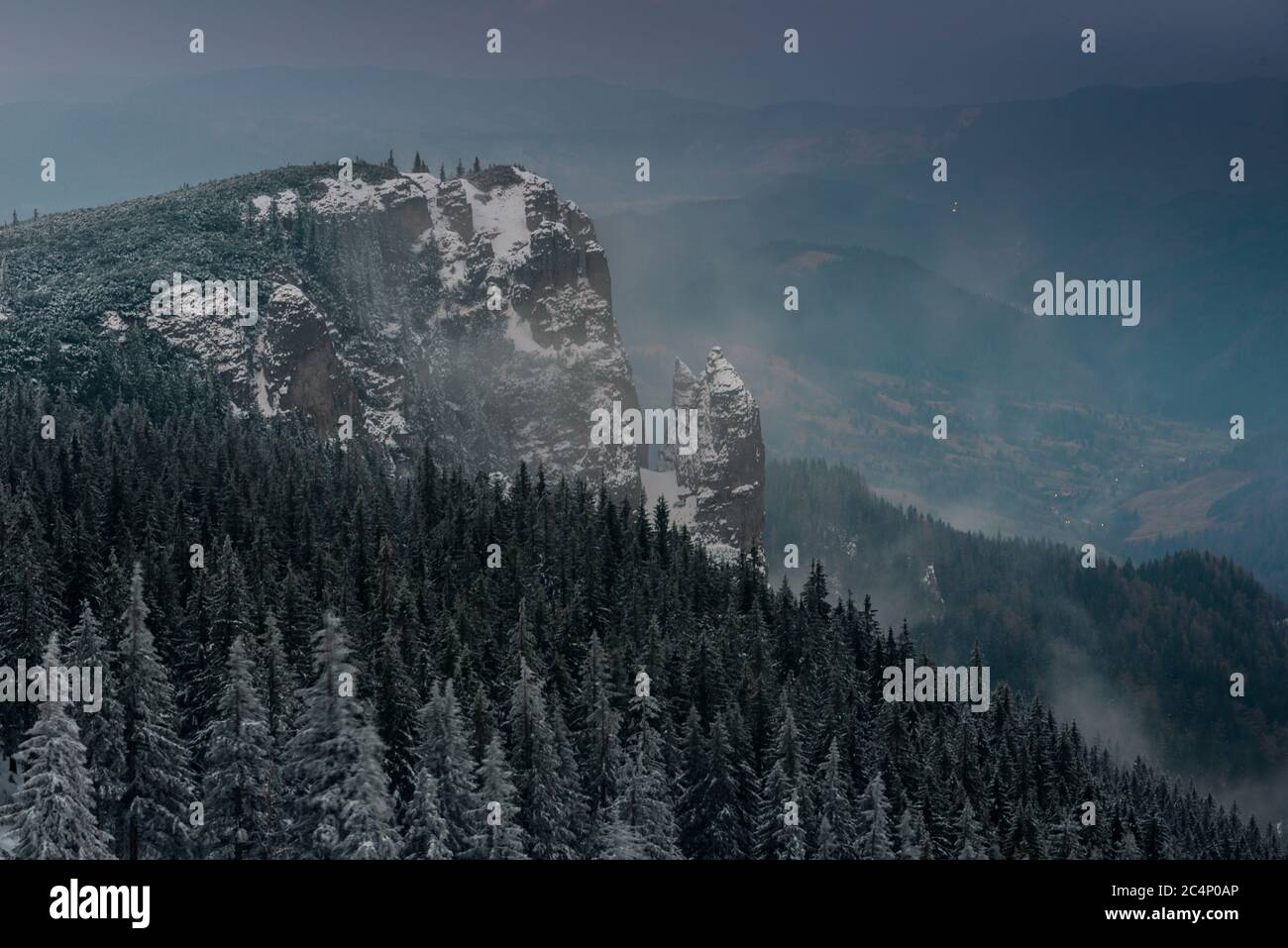rocky mountains full of snow and villages in the valley Stock Photo - Alamy