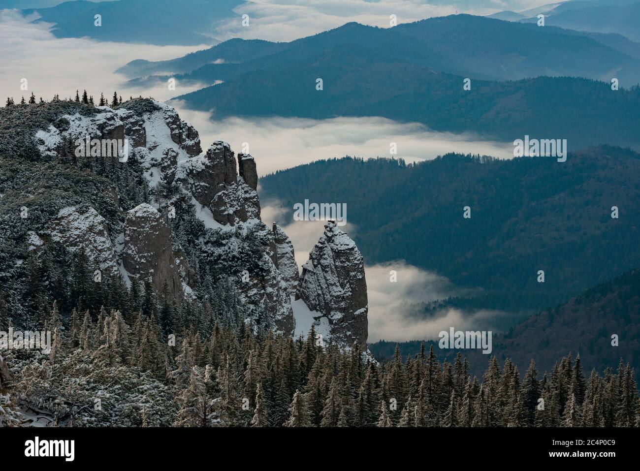 rocky mountains full of snow and villages in the valley Stock Photo - Alamy