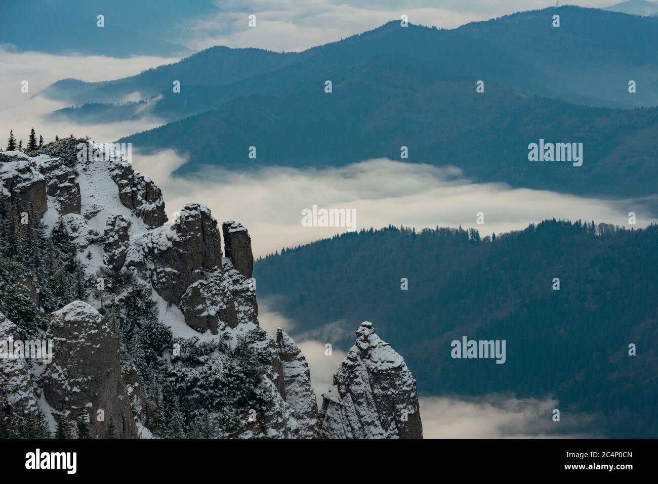 rocky mountains full of snow and villages in the valley Stock Photo - Alamy
