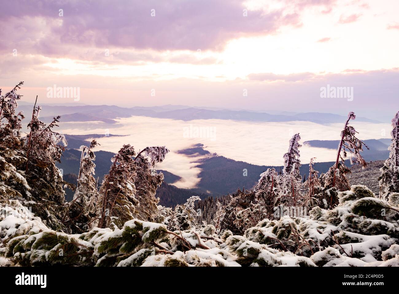 rocky mountains full of snow and villages in the valley Stock Photo - Alamy