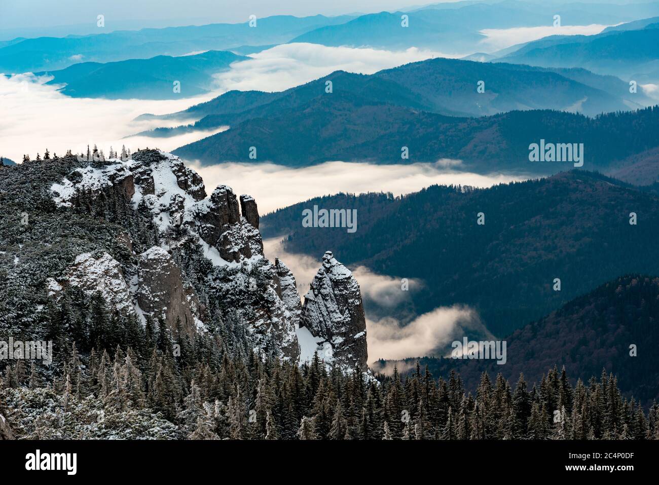 rocky mountains full of snow and villages in the valley Stock Photo - Alamy