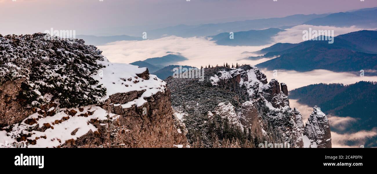 rocky mountains full of snow and villages in the valley Stock Photo - Alamy