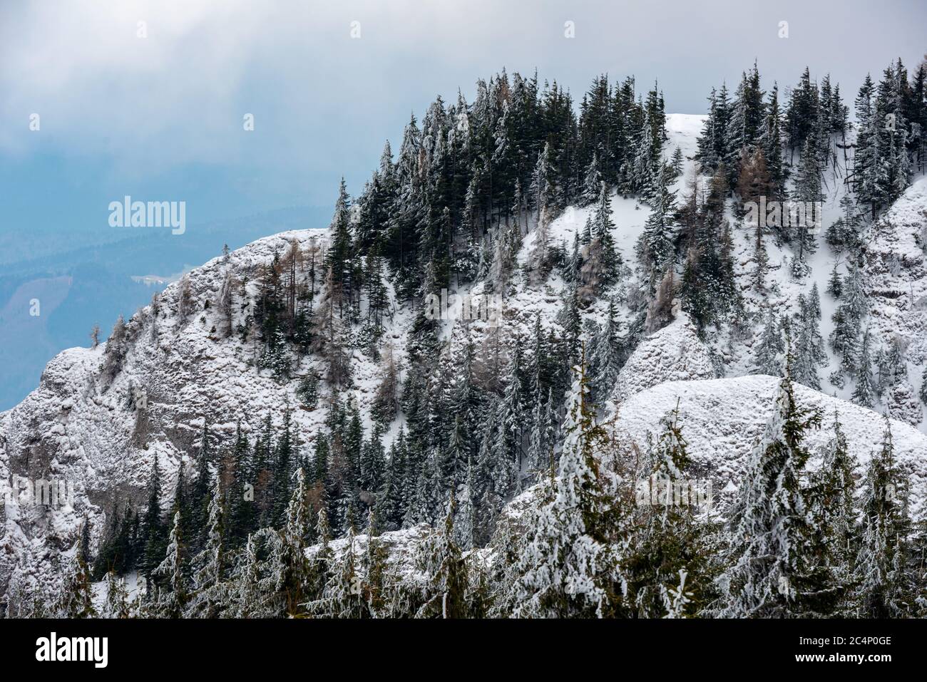 rocky mountains full of snow and villages in the valley Stock Photo - Alamy