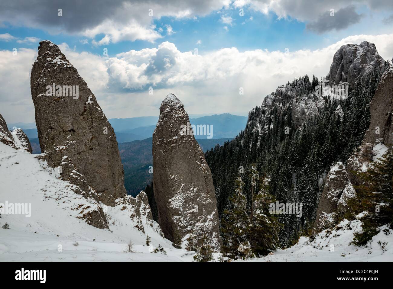 rocky mountains full of snow and villages in the valley Stock Photo - Alamy