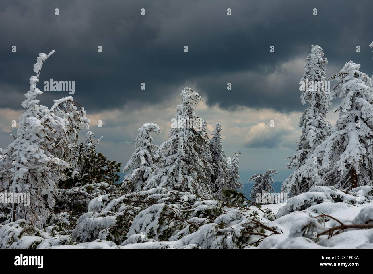 rocky mountains full of snow and villages in the valley Stock Photo - Alamy