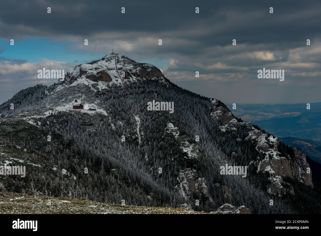 rocky mountains full of snow and villages in the valley Stock Photo - Alamy