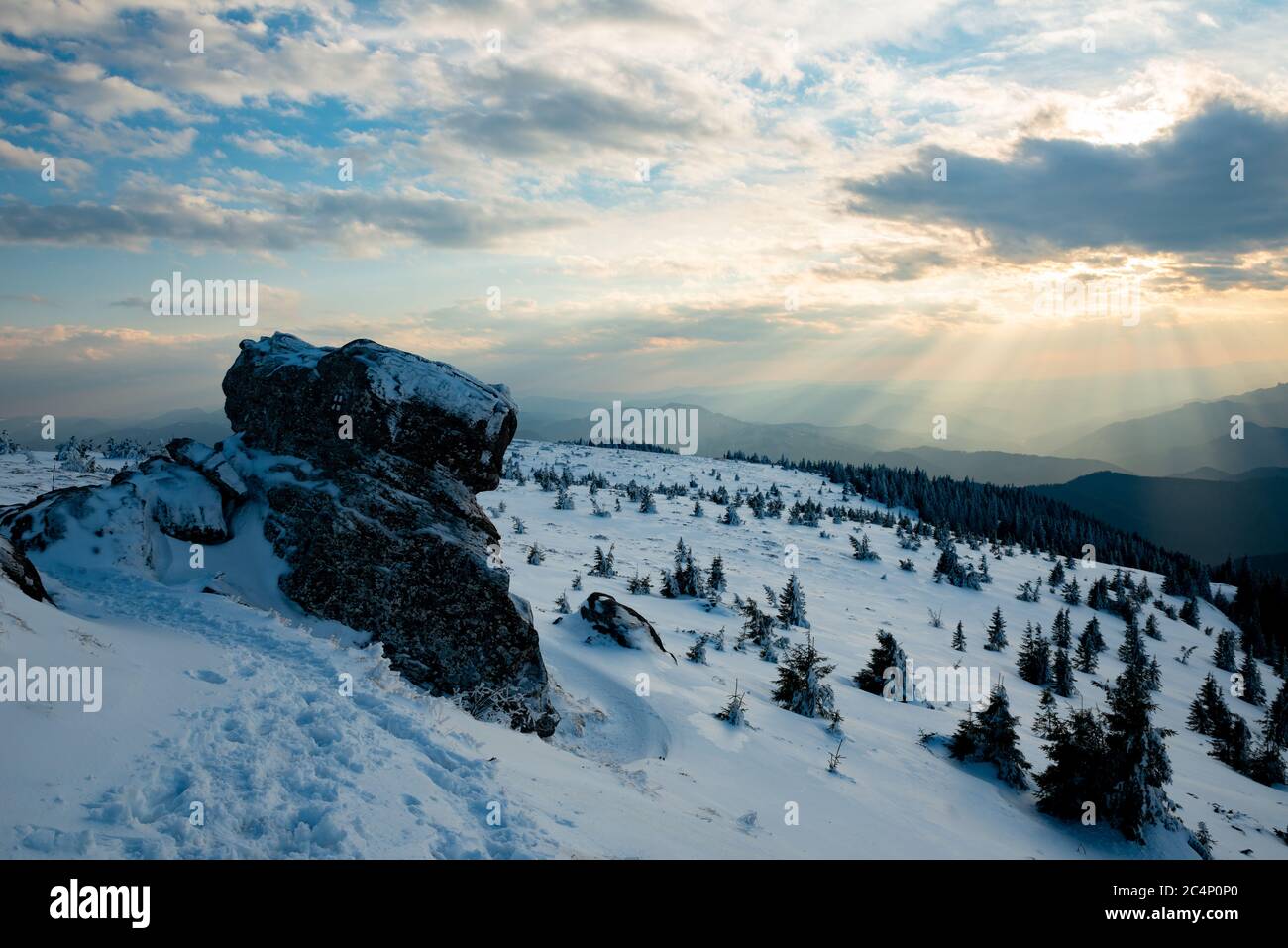 rocky mountains full of snow and villages in the valley Stock Photo - Alamy