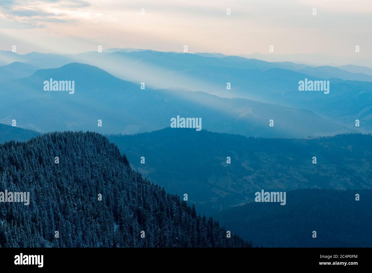 rocky mountains full of snow and villages in the valley Stock Photo - Alamy