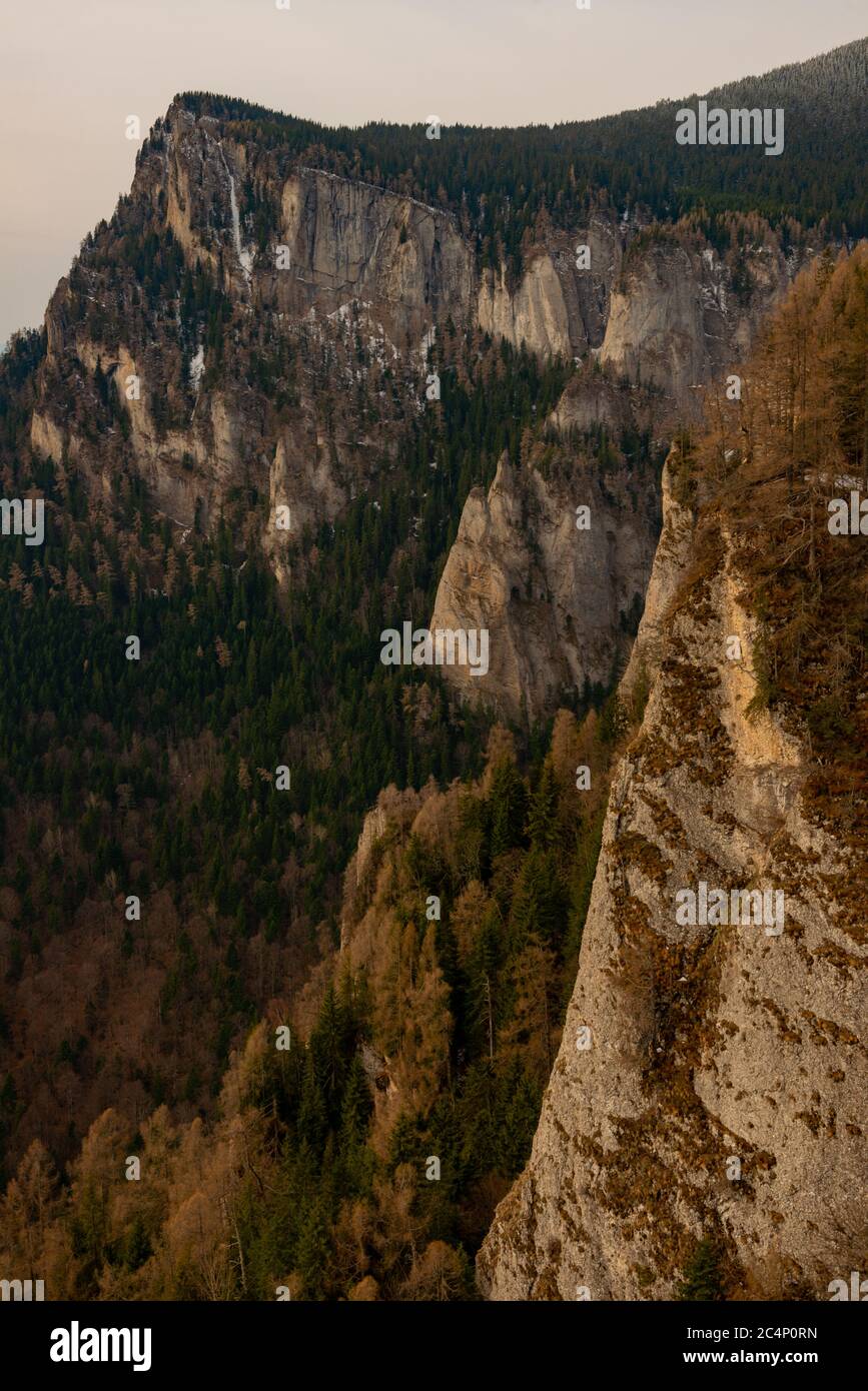 rocky mountains full of snow and villages in the valley Stock Photo - Alamy