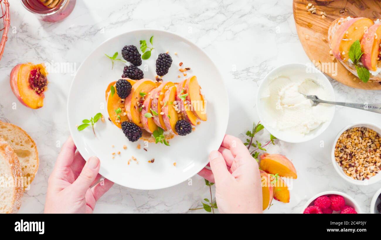 Flat lay. Step by step. Making ricotta toasts with organic peaches and ...