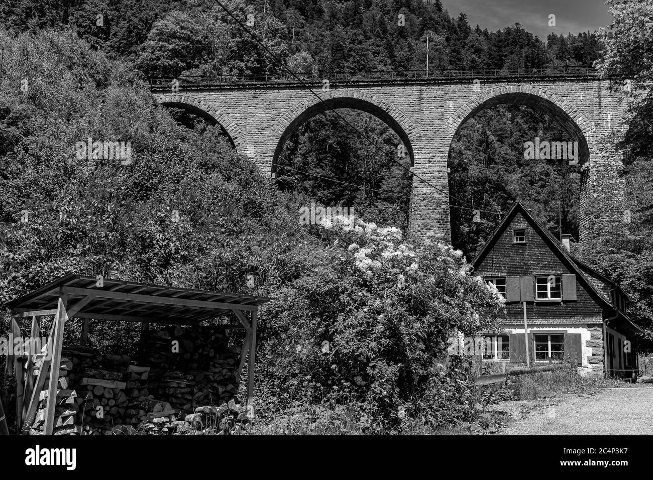 Spectacular view of an old house in front of the old railway bridge at ...