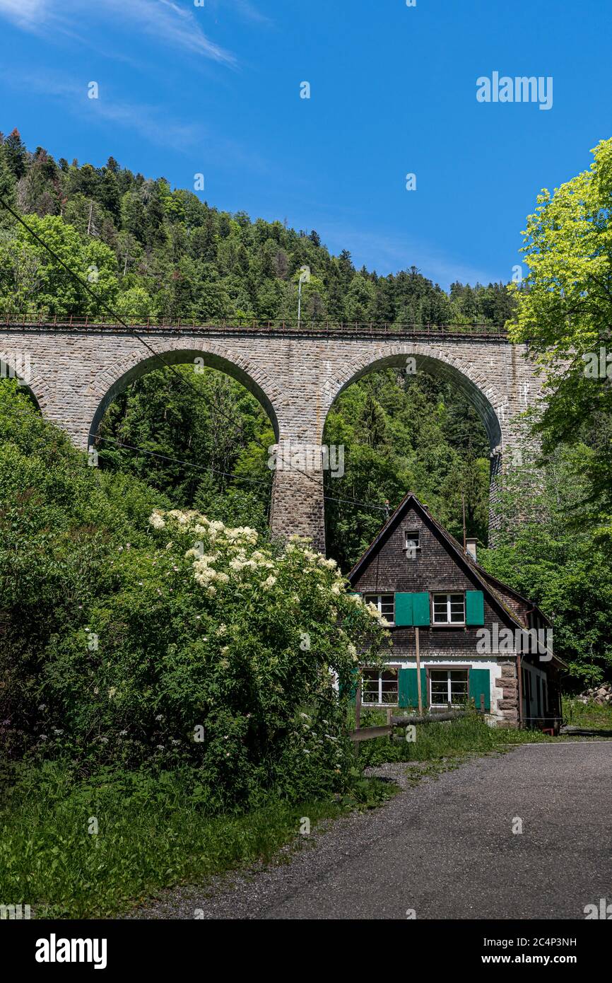 Spectacular view of an old house in front of the old railway bridge at ...