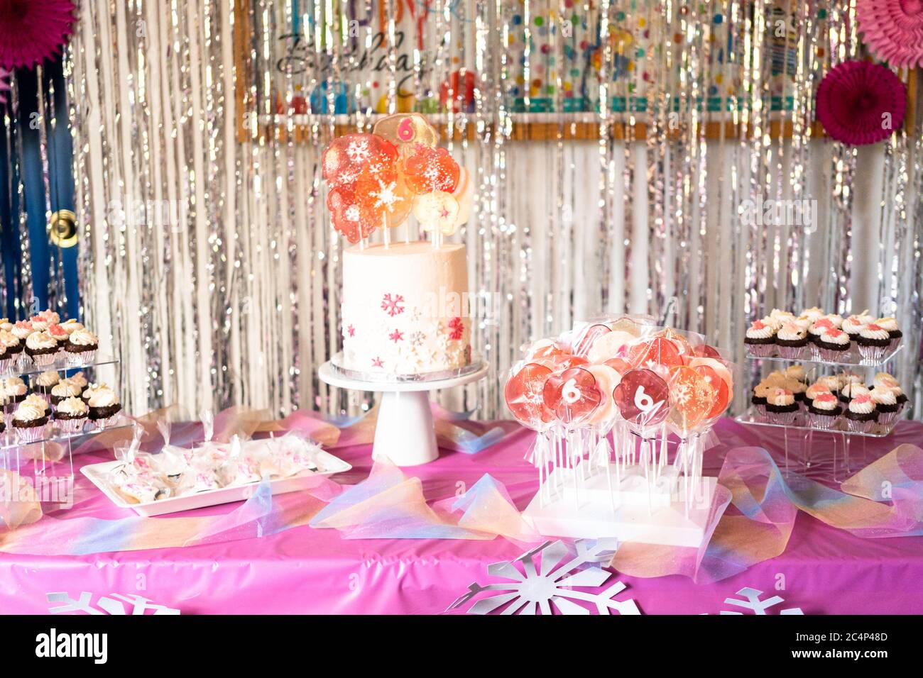 Table with cake and desserts at the little girl's birthday party Stock ...