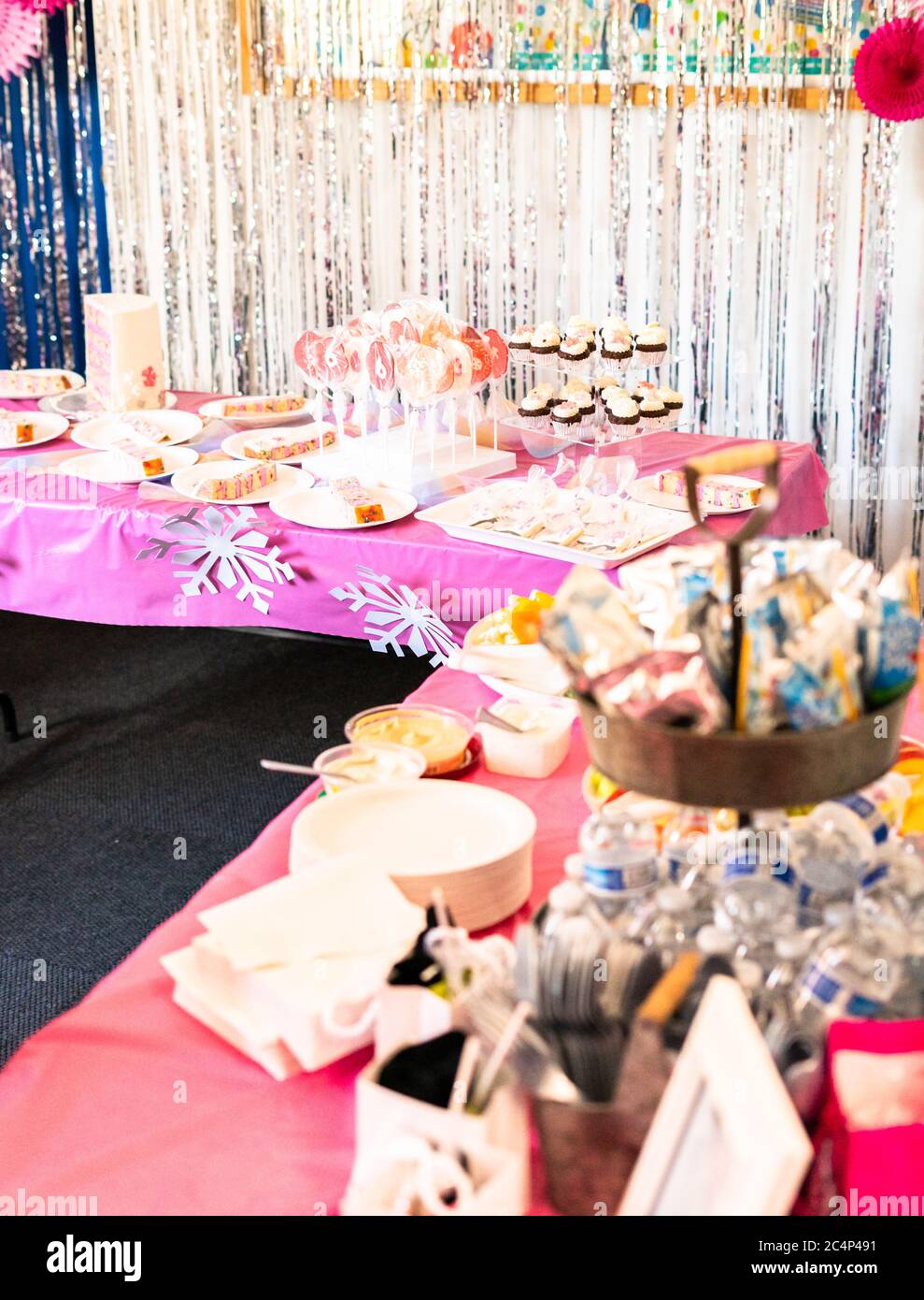 Table with cake and desserts at the little girl's birthday party Stock ...
