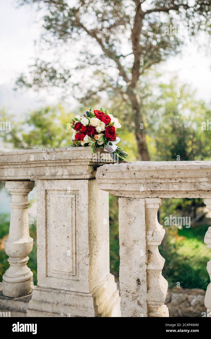 bridal bouquet of white, read and cream roses, ornithogalum, eryngium ...