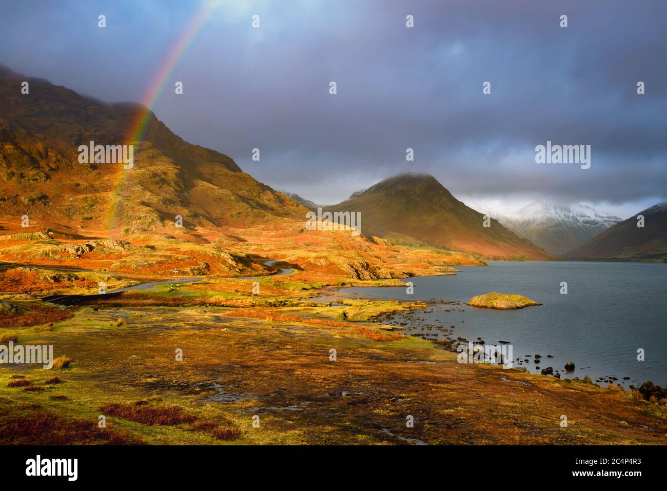 Rainbow In A Dramatic Landscape With Evening Golden Light On Mountains ...