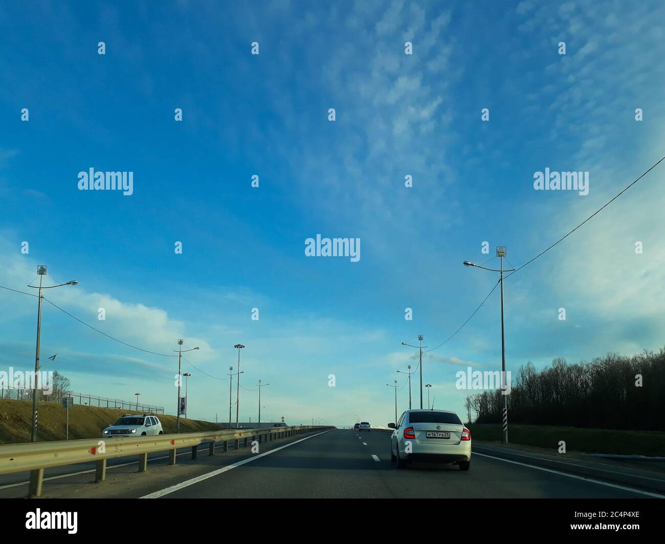 A road or highway leading to the horizon. View from the car window ...
