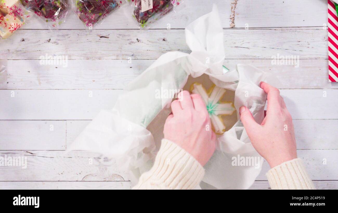 Flat lay. Step by step. Packaging homemade fudge and cookies into a ...