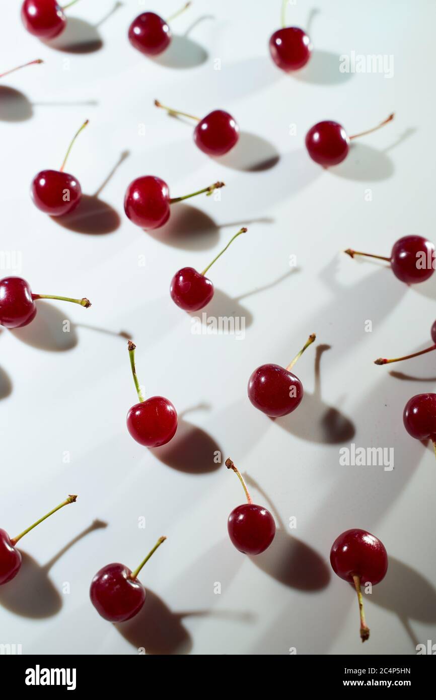 Group of cherry on a white background with shadows. Close-up. Top view ...