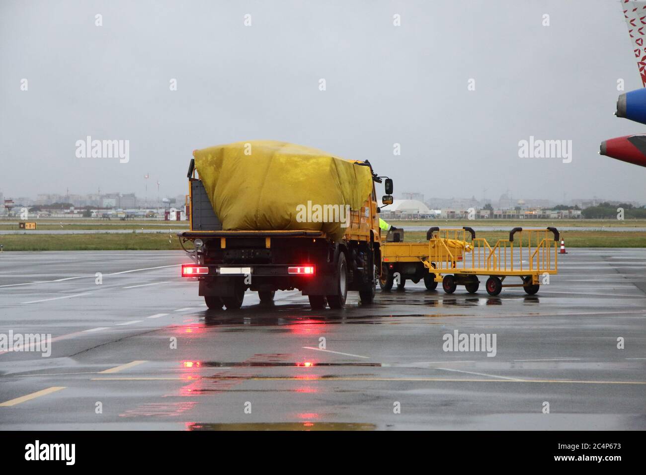 yellow lorry for servicing of aircraft on airport flying field Stock ...