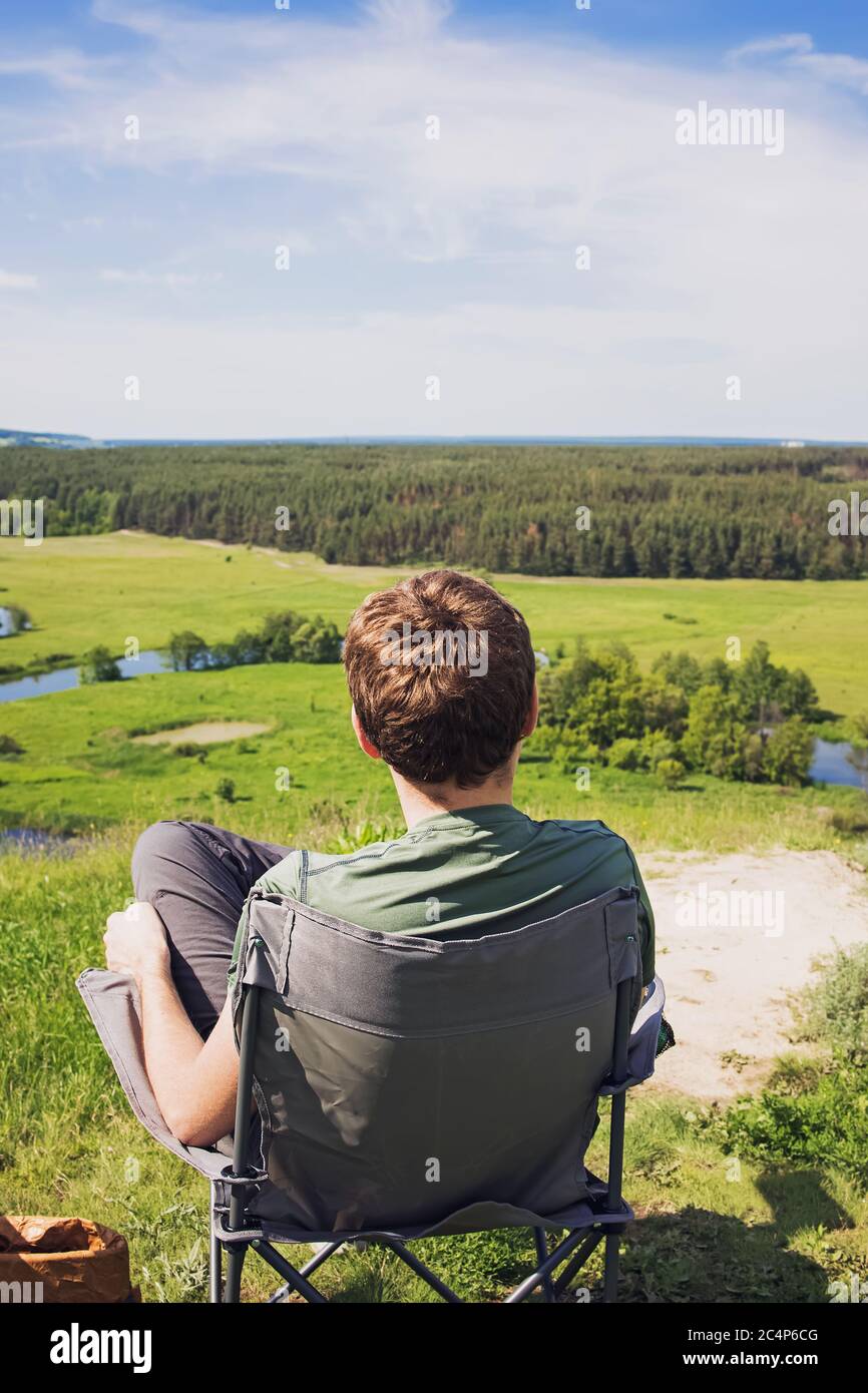 Man resting chair back view hi-res stock photography and images - Alamy