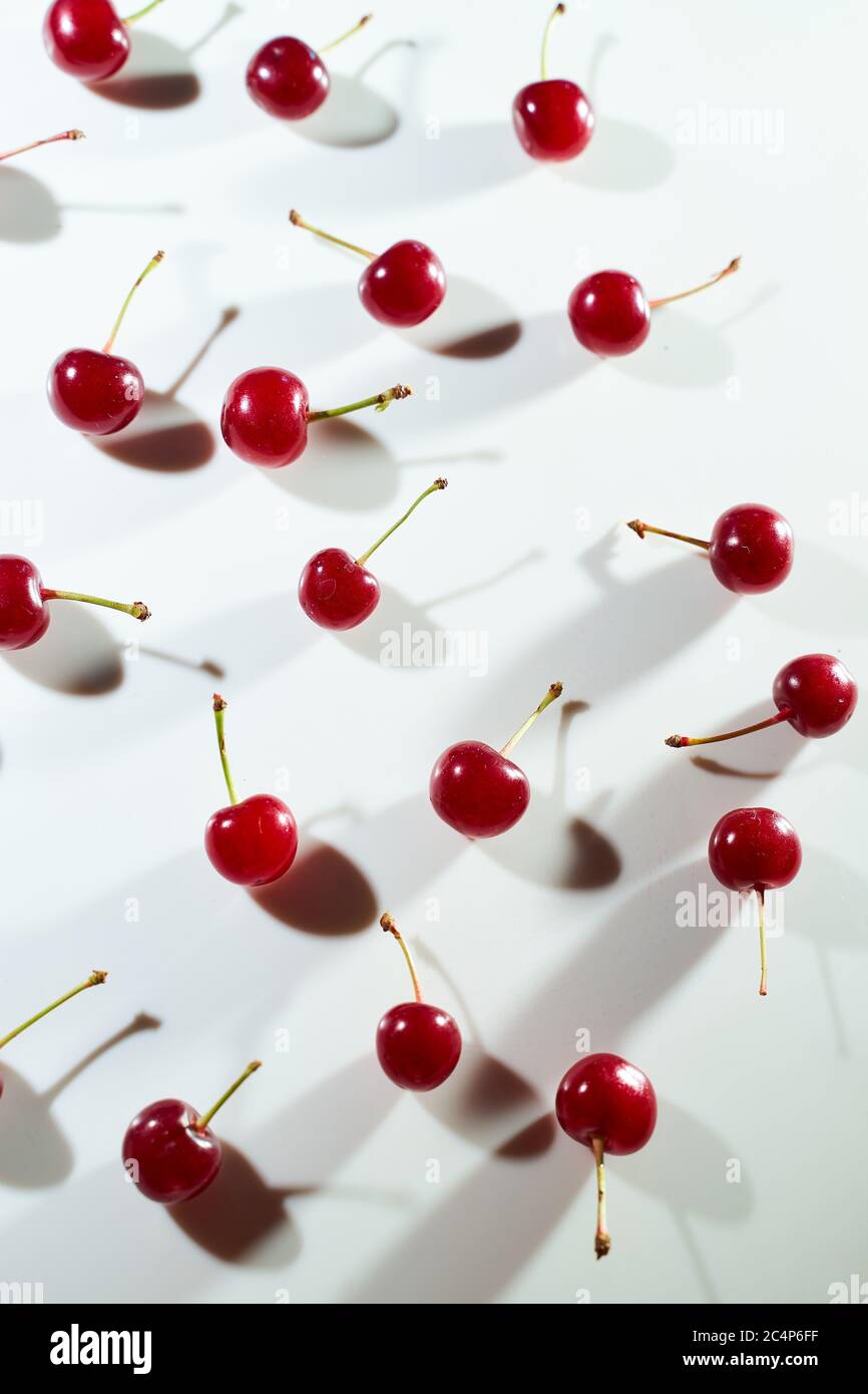 Group of cherry on a white background with shadows. Close-up. Top view ...
