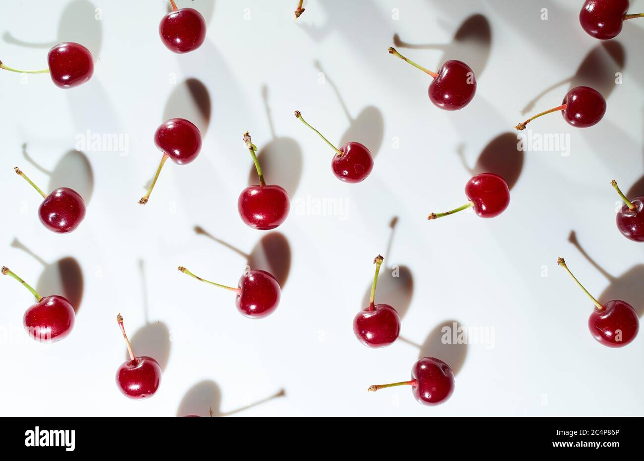 Group of cherry on a white background with shadows. Close-up. Top view ...