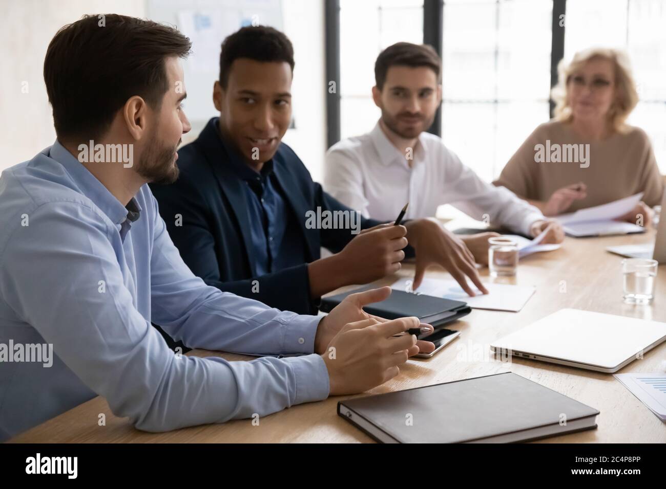 Businessman discussing project diverse partners hi-res stock ...
