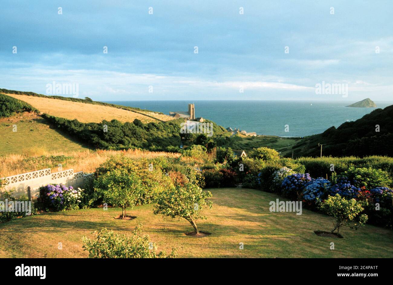 Wembury Bay with church and Great Mew Stone, south Devon, England, seen ...