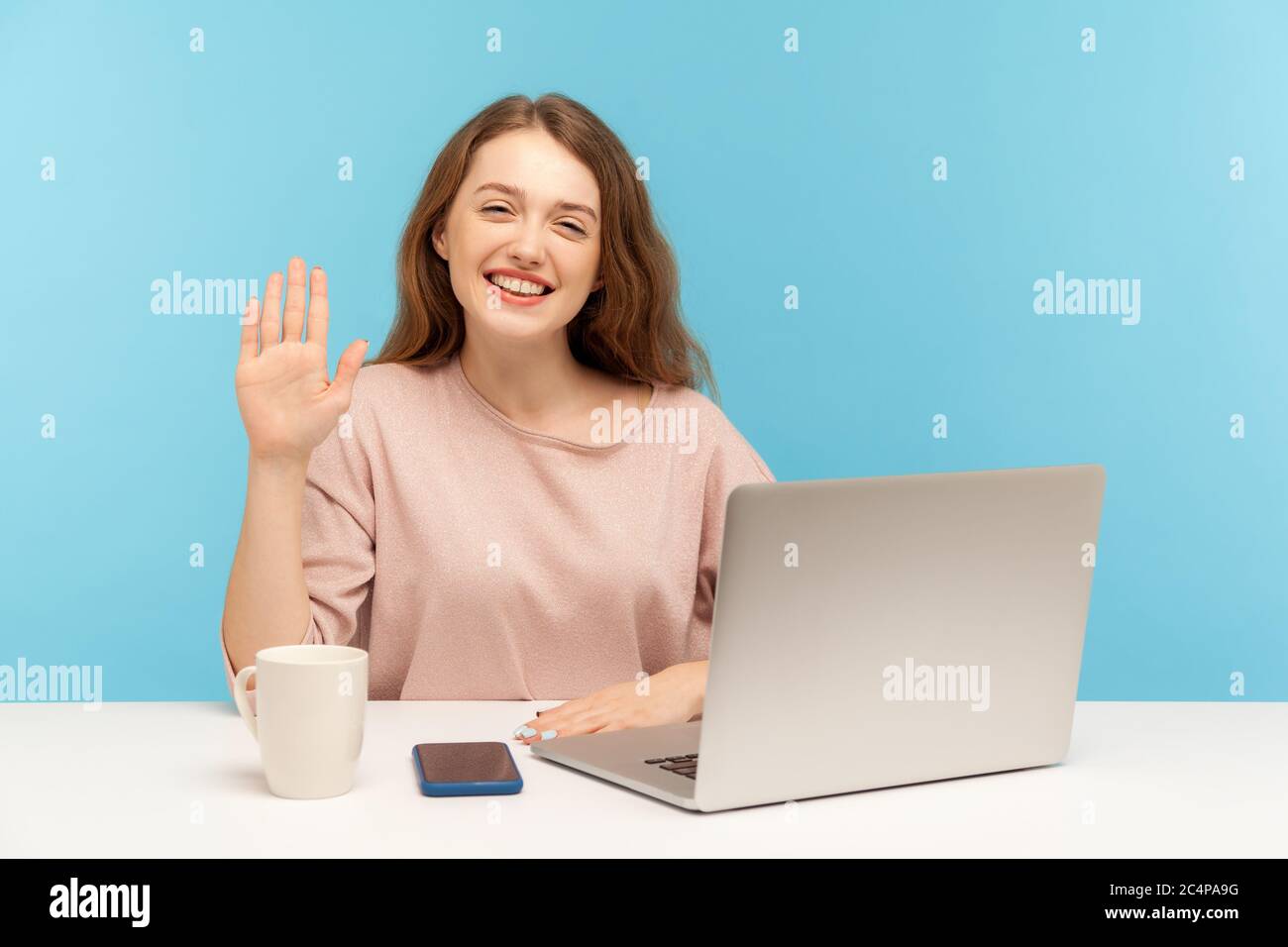Hi! Friendly beautiful young woman employee waving hand gesturing hello ...