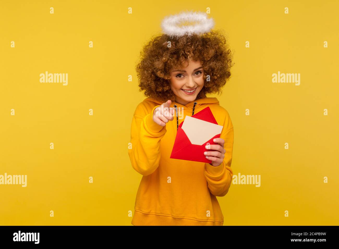 Love message. Portrait of pretty curly-haired angelic woman with saint ...