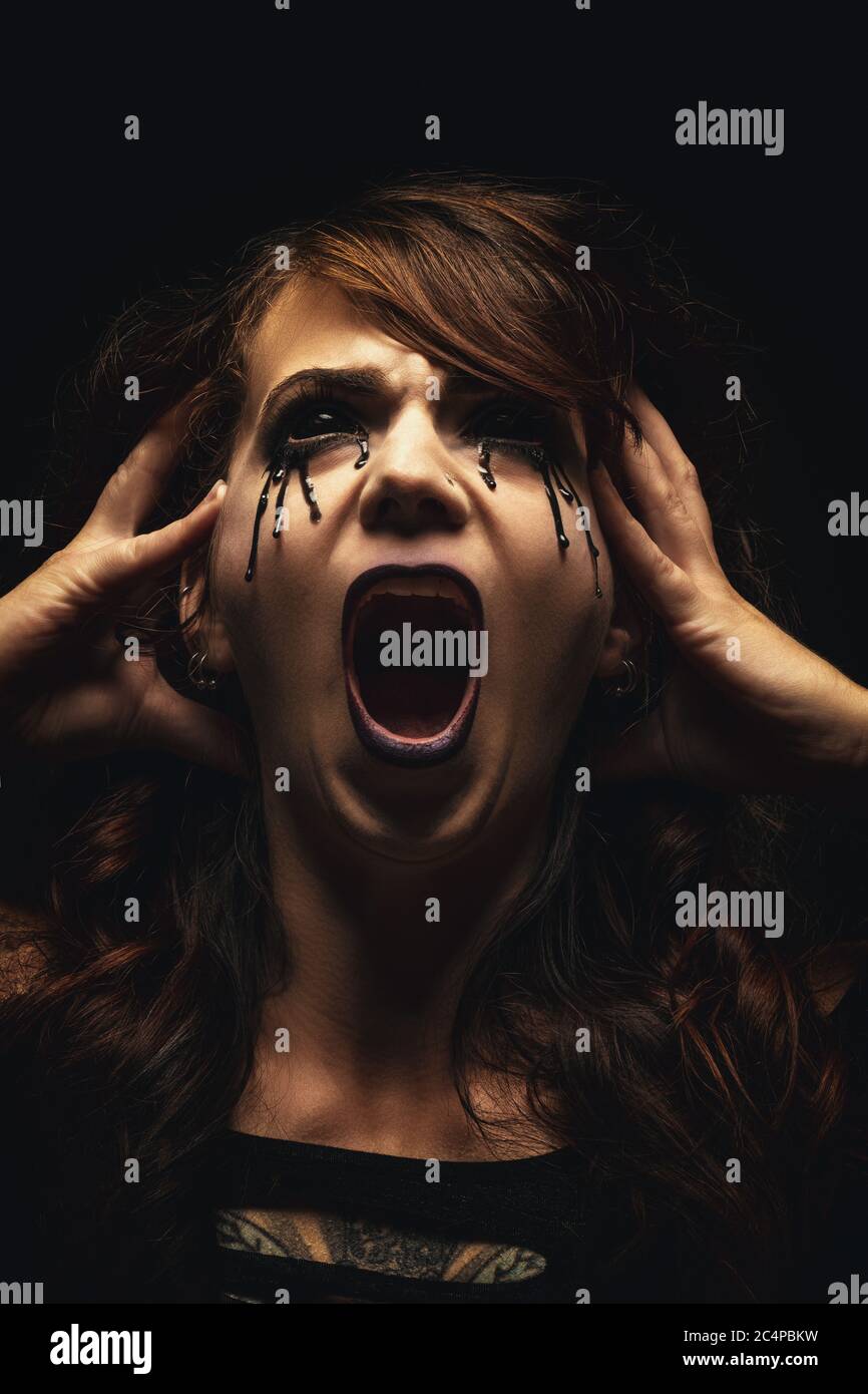 Portrait of a possessed woman, bloody eyes, face expressing suffering ...