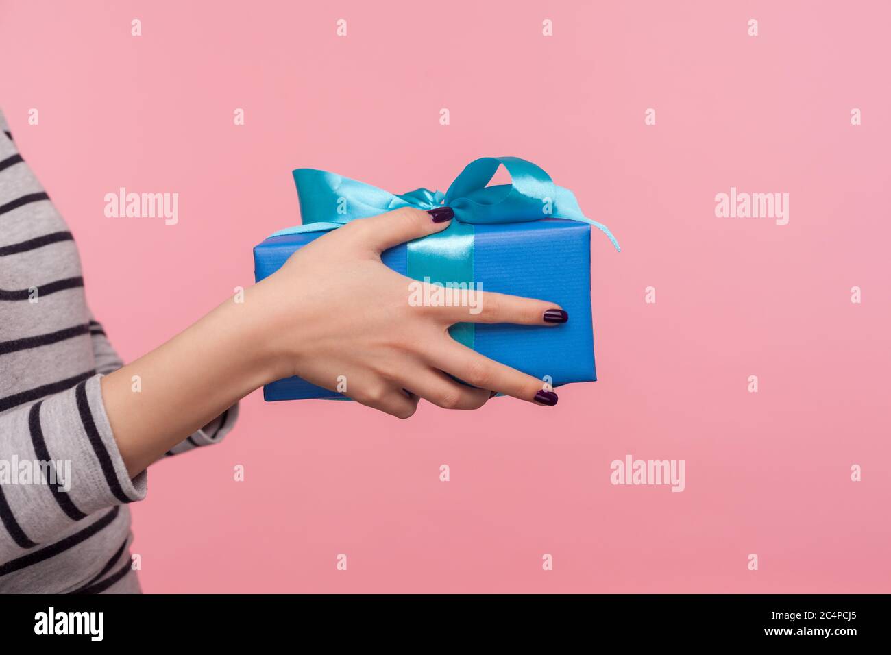 Closeup woman hands holding blue gift box, romantic surprise for ...