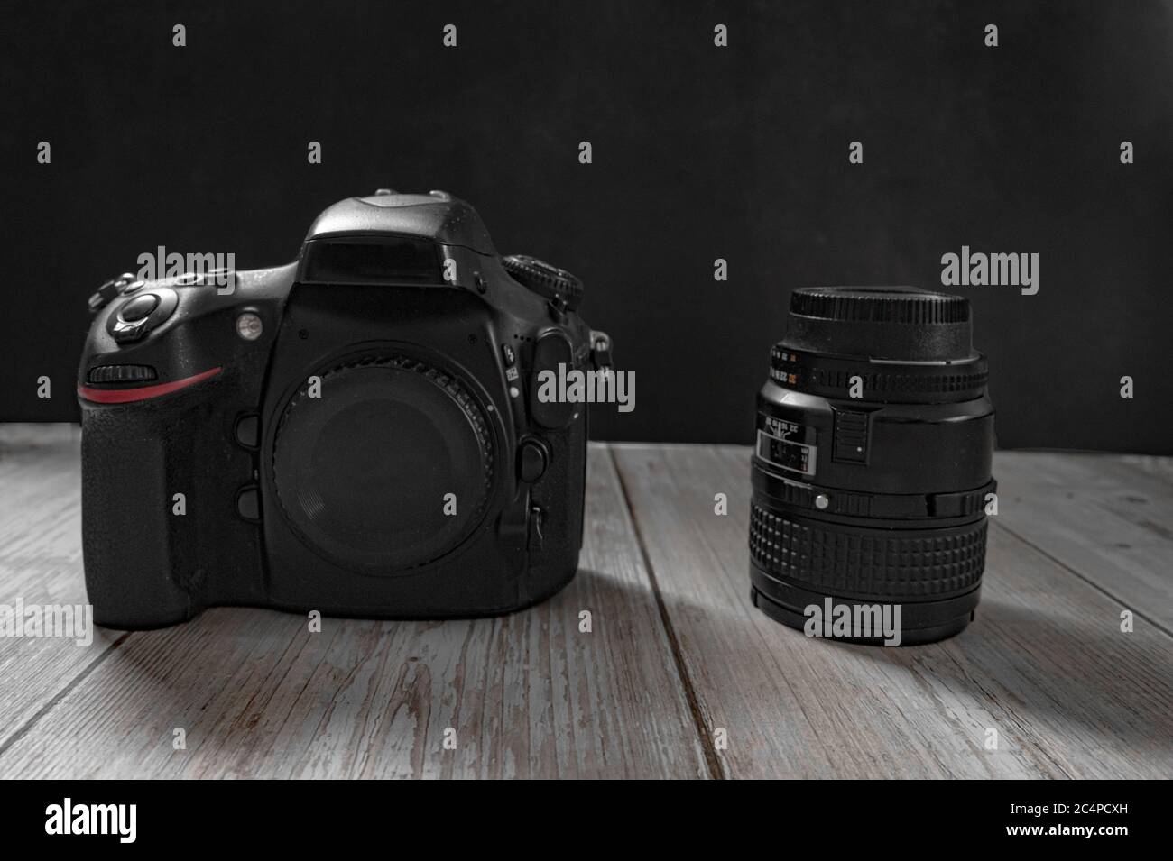 dslr camera with lens on black background Stock Photo - Alamy