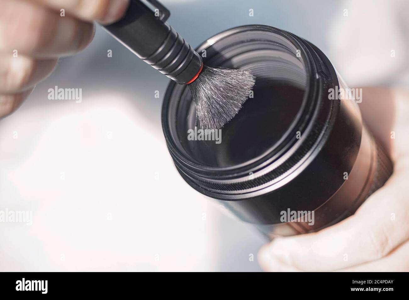 dslr camera lens cleaning brush removes dust from the lens glass Stock ...