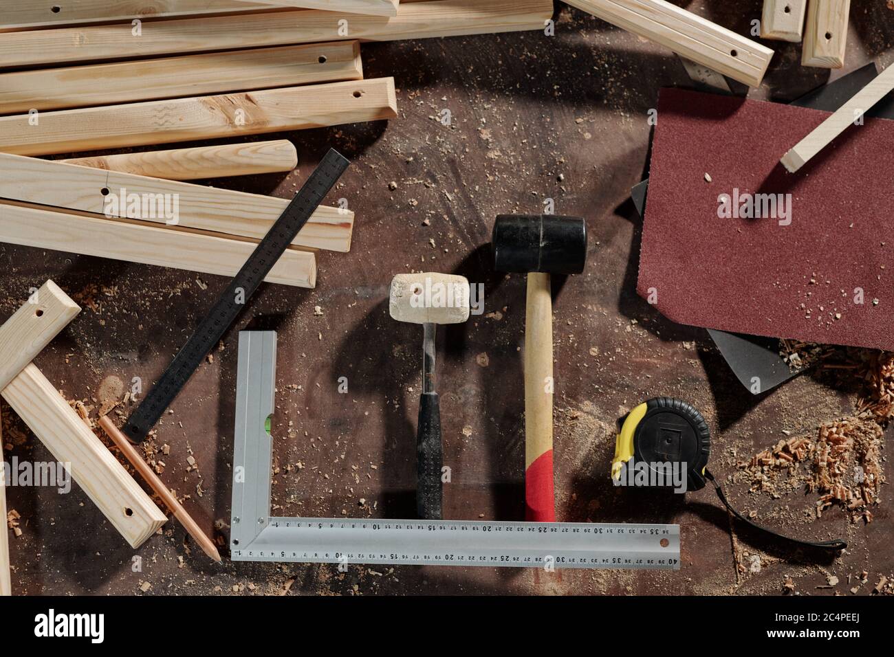 Above view of carpenters tools such as hammers, tape measure ...