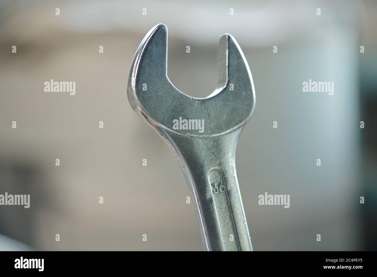 Close-up of metal wrench used to turn bolts and nuts in workshop ...
