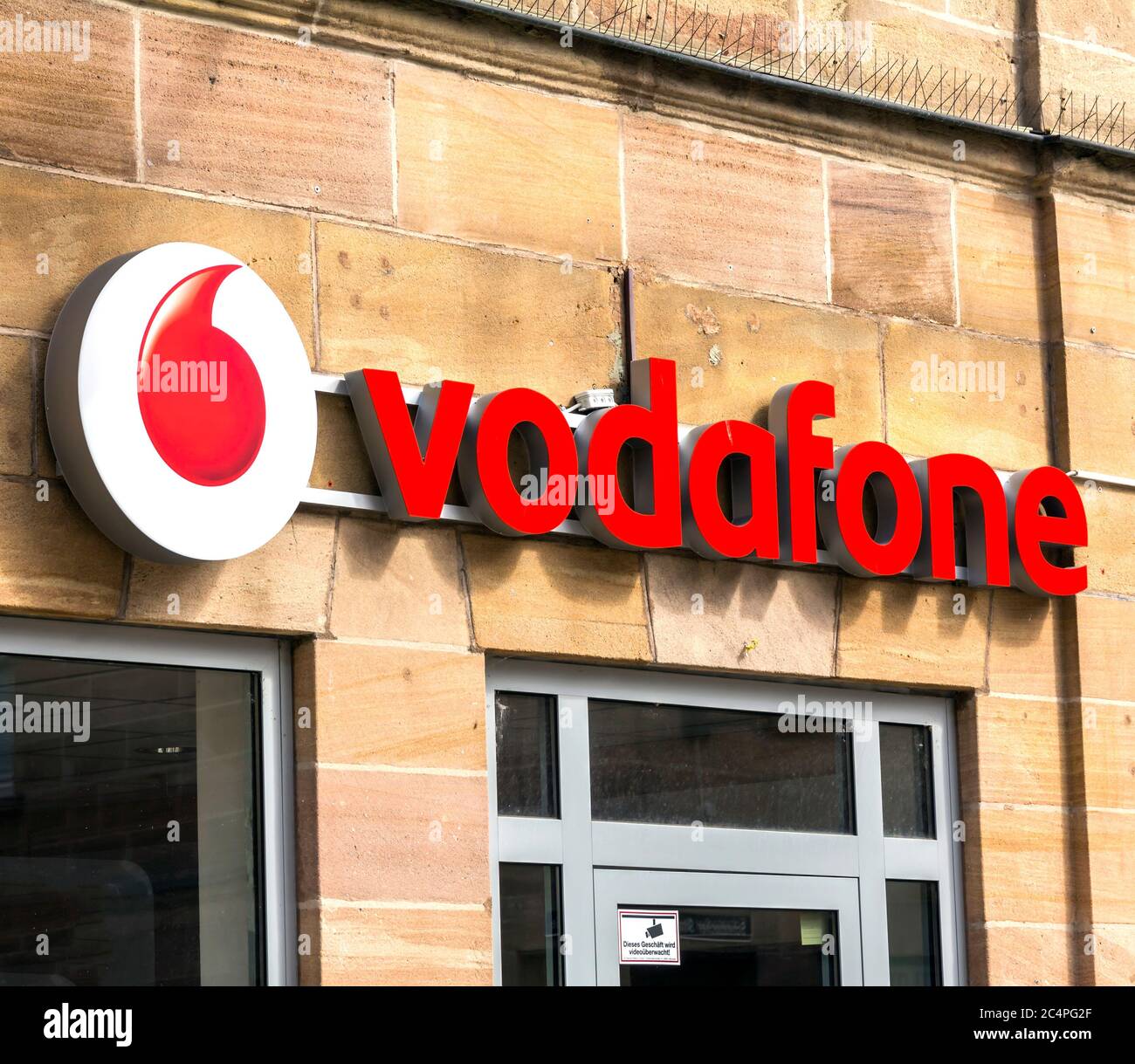 FURTH, GERMANY: Logo of Vodafone - Vodafone is a British multinational ...