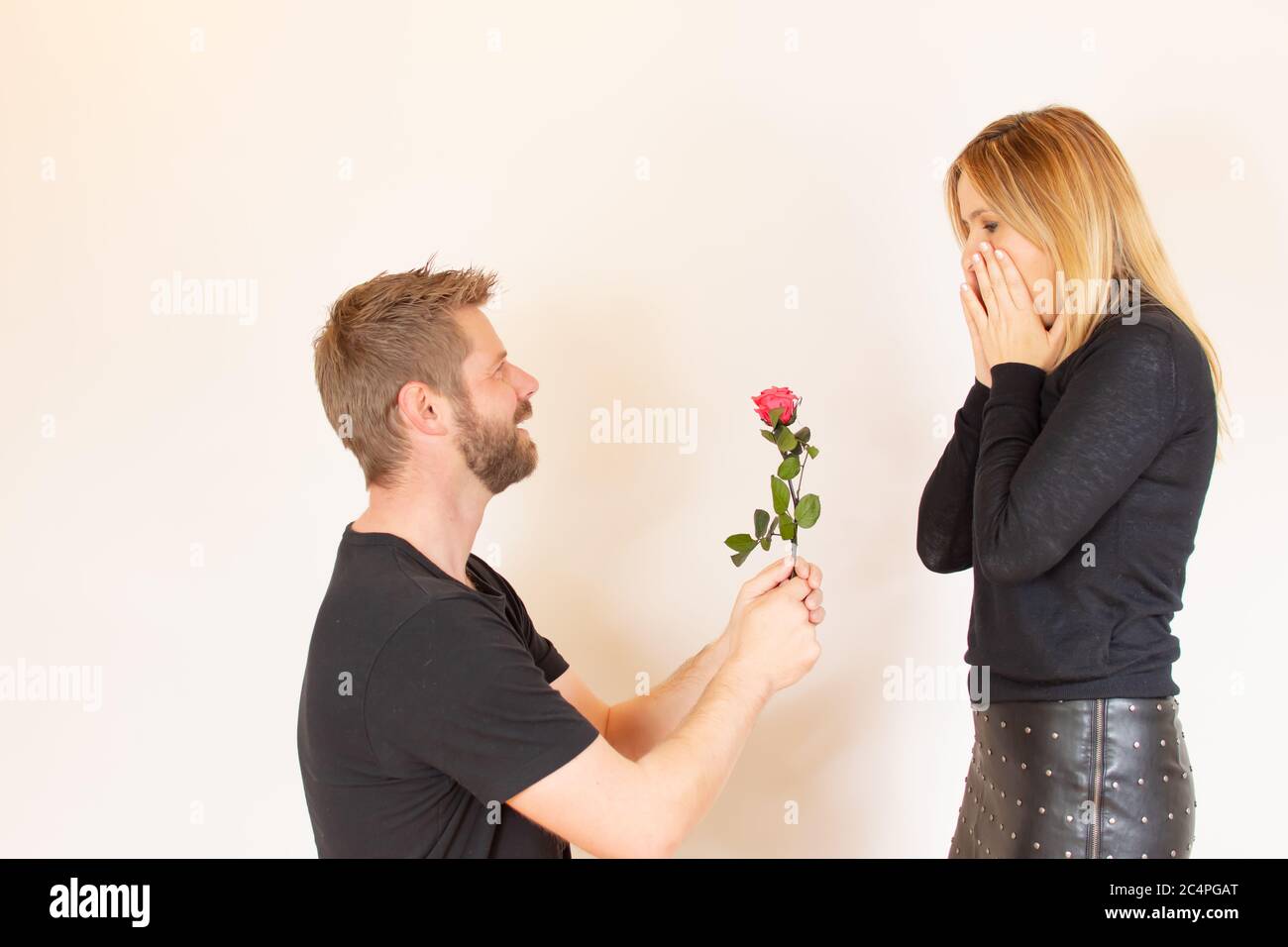 Romantic couple receiving a rose Stock Photo - Alamy