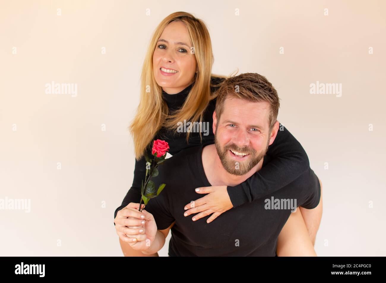 Romantic couple receiving a rose Stock Photo - Alamy