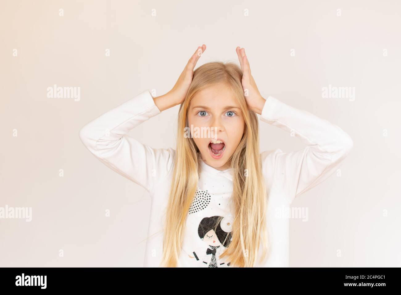 Surprised girl blond long hi-res stock photography and images - Alamy