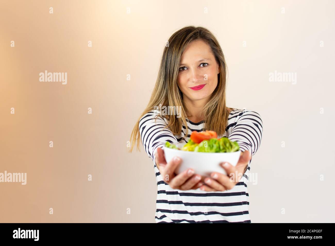 Woman laughing alone with salad hi-res stock photography and images - Alamy