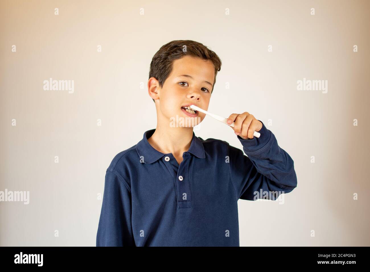 Young boy with toothbrush in his hand Stock Photo - Alamy